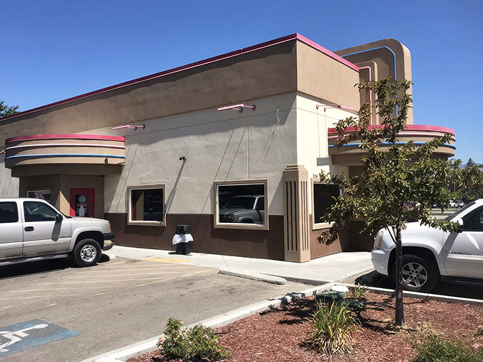 Big Jud's Art Deco-inspired exterior stands like a time machine to burger paradise, complete with that iconic pink trim that says "serious comfort food inside."