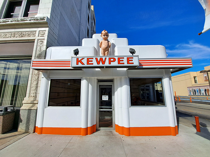 The iconic Kewpee exterior stands like a time capsule of Americana, complete with that watchful doll perched atop like a burger guardian angel.