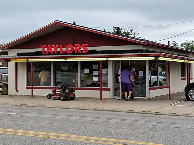 The classic red and white exterior of Taylor's Maid-Rite stands as a beacon of culinary tradition in downtown Marshalltown, promising loose-meat perfection within.
