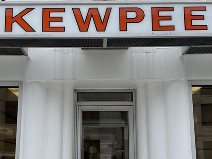 The iconic Kewpee exterior stands like a time capsule of Americana, complete with that watchful doll perched atop like a burger guardian angel.