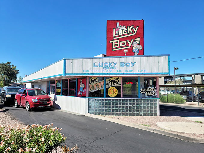 The bright red Lucky Boy sign against the Arizona sky isn't just signage &ndash; it's a beacon of burger bliss that's been guiding hungry Phoenicians home since Eisenhower was in office. 