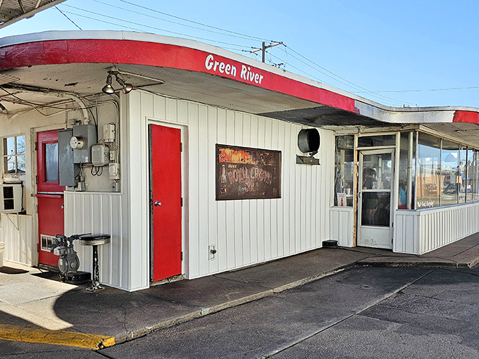 The iconic white building with red trim has been a Hutchinson landmark since 1948. The "Green River" sign promises nostalgic delights within.