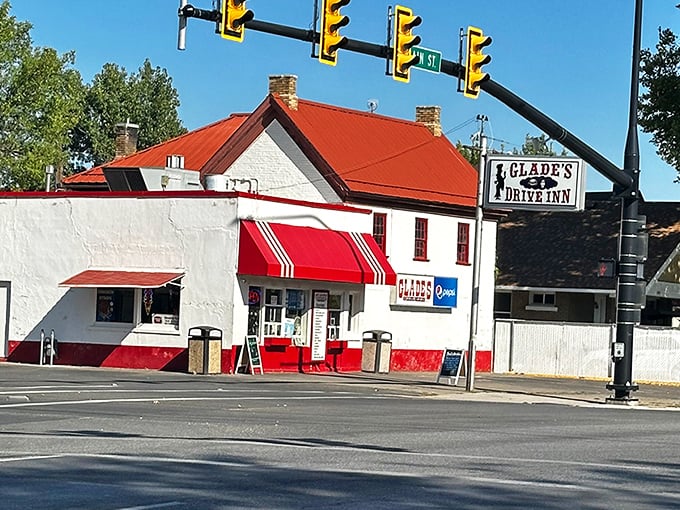 The classic red and white exterior of Glade's stands like a time capsule on Spanish Fork's corner, beckoning hungry travelers with nostalgic charm.