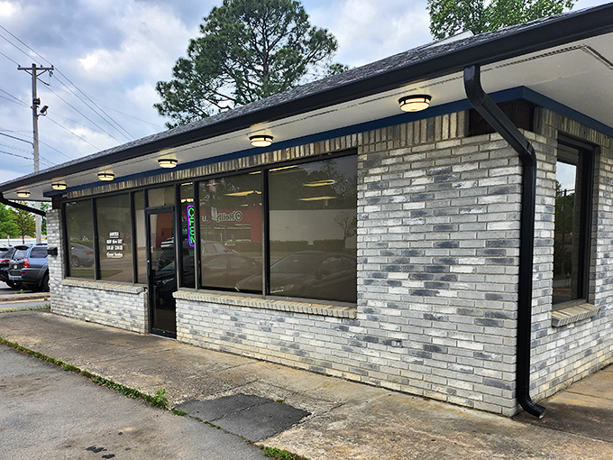 The unassuming storefront where donut dreams come true. Blue skies above, sweet treasures within&mdash;North Little Rock's hidden gem awaits.