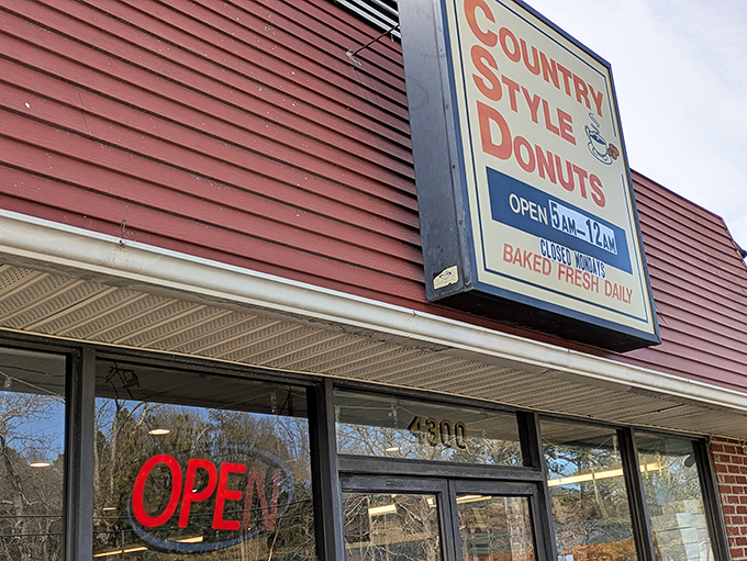 The red siding and vintage sign promise a time-traveling donut experience. Some buildings just whisper "delicious things happen here," and this one shouts it.