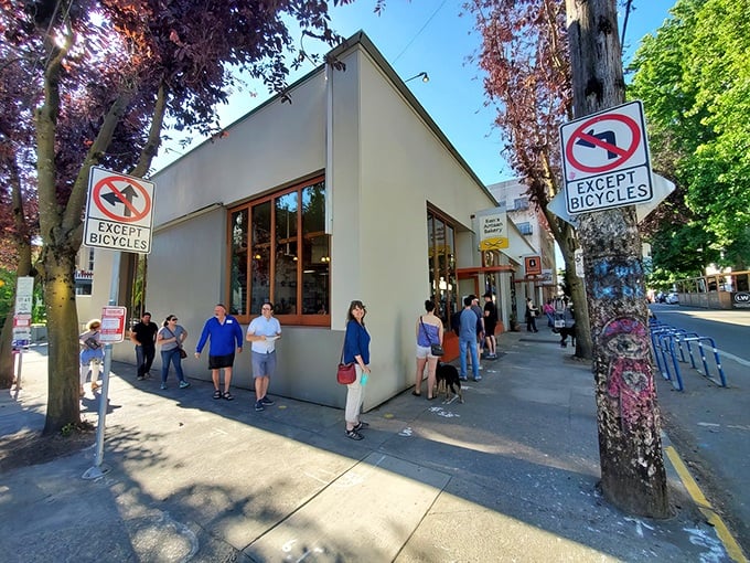 The unassuming storefront of Ken's Artisan Bakery might fool you, but locals know this yellow sign marks the spot where bread dreams come true.