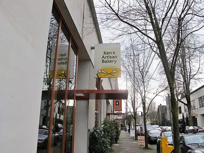 The unassuming storefront of Ken's Artisan Bakery might fool you, but locals know this yellow sign marks the spot where bread dreams come true.