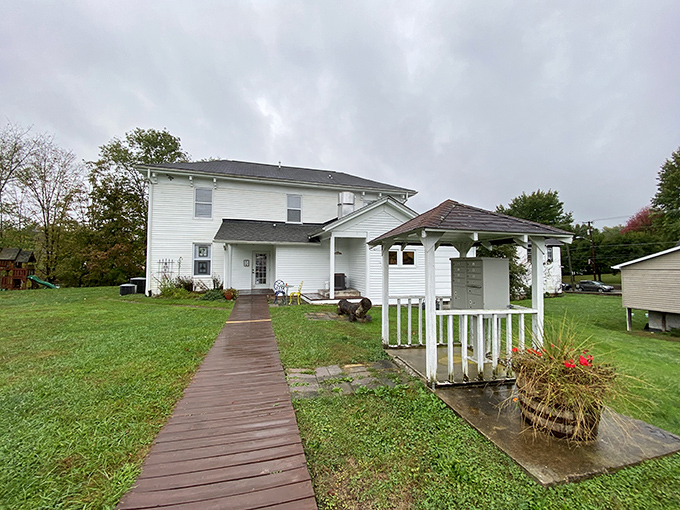The journey to breakfast bliss begins with this charming white farmhouse. A wooden walkway practically begs you to follow it toward culinary adventure.