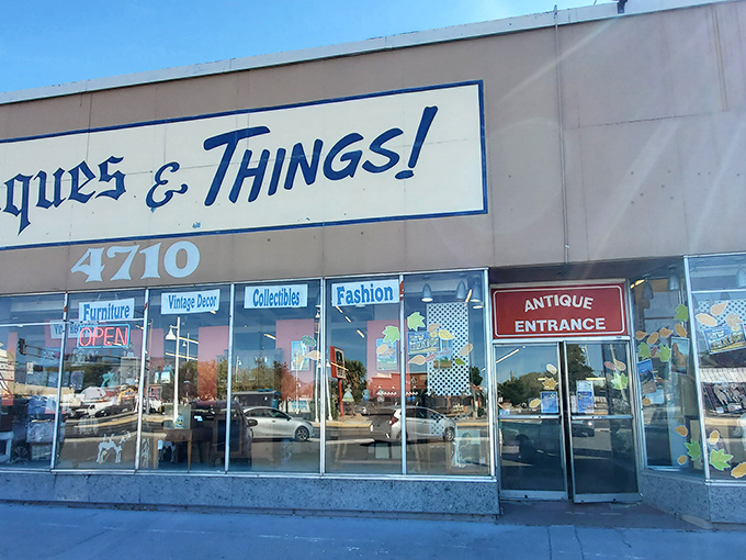 The storefront beckons with promises of treasures within, its blue lettering against beige like a desert sky invitation to explore.