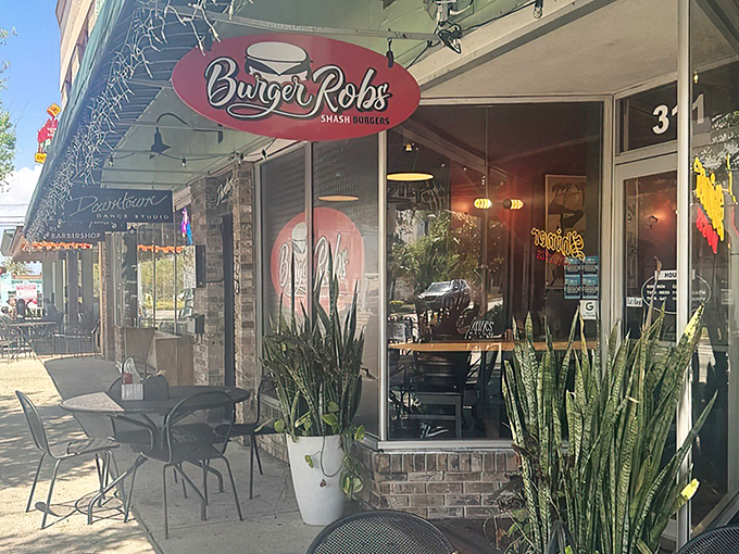 The unassuming storefront of BurgerRobs in Titusville beckons with its red signage and outdoor seating&mdash;a burger sanctuary hiding in plain sight.