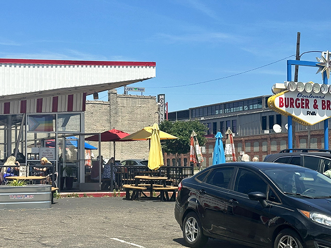 The retro-futuristic design of Boulevard Burger & Brew beckons like a time machine disguised as a diner. Those colorful umbrellas aren't just for show&mdash;they're happiness markers.
