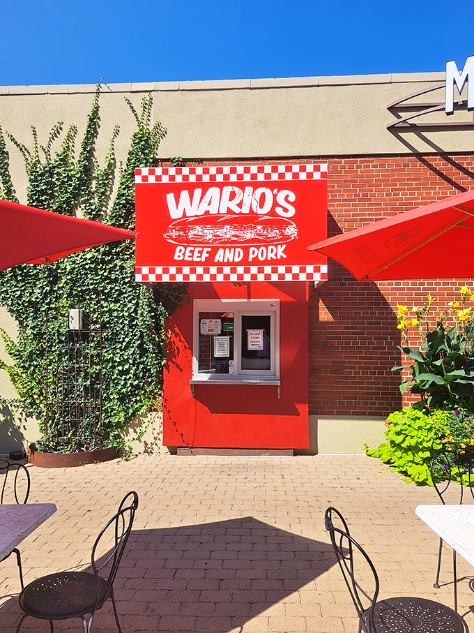 The unassuming brick exterior of Wario's might not scream "food destination," but that red checkered sign is like a beacon for sandwich aficionados across Columbus.