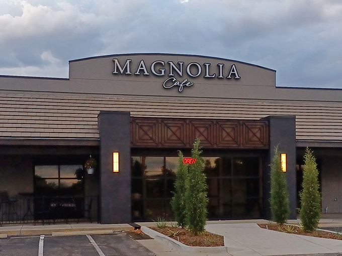 The sleek gray exterior of Magnolia Cafe stands like a culinary beacon in Wichita, promising delicious adventures within. That evergreen isn't just decoration&mdash;it's your first hint of the freshness awaiting inside.
