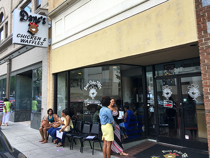 The brick exterior of Dame's Chicken & Waffles stands like a beacon of comfort food in downtown Durham, promising culinary adventures worth every calorie.