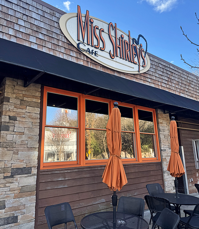 The iconic Miss Shirley's sign welcomes hungry pilgrims to breakfast paradise. Stone and wood exterior with signature orange lettering promises Southern comfort with Maryland flair.