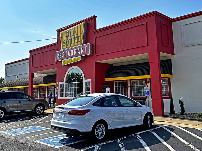 The bright red exterior with bold yellow signage isn't trying to be subtle &ndash; it's proudly announcing "good food happens here!" No Instagram filter required.
