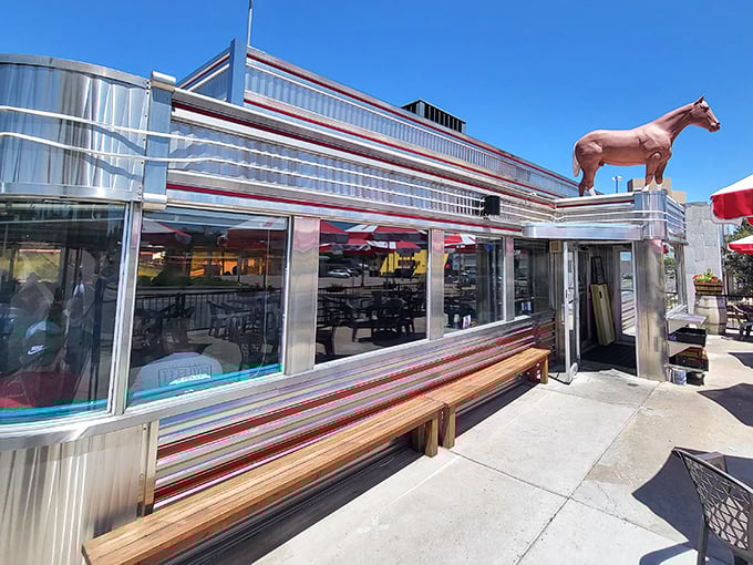 Shiny chrome and retro vibes await as you grab a seat under the watchful eye of a rooftop horse statue.