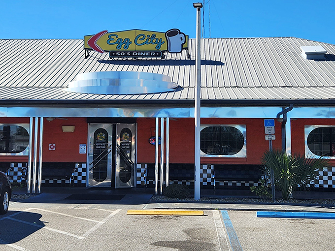 The vibrant orange exterior with its classic checkered trim isn't just eye-catching&mdash;it's a beacon of breakfast hope for hungry travelers on Florida's highways.