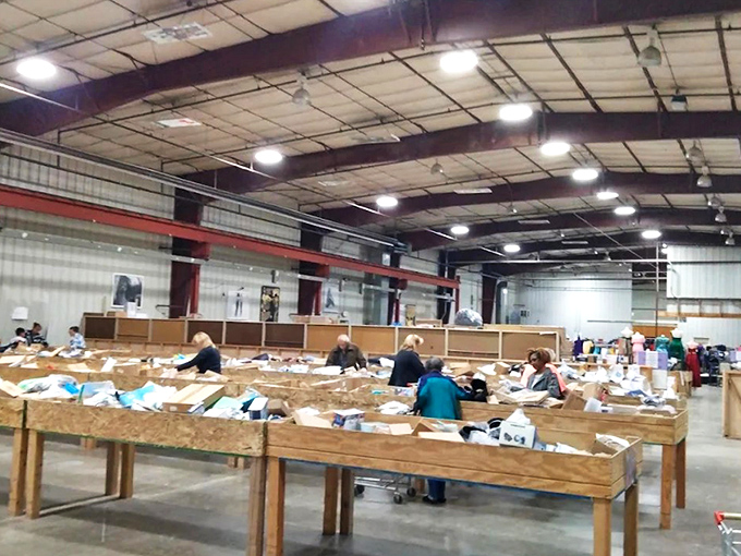 Treasure hunting paradise! Wooden bins stretch across the warehouse floor like archaeological sites waiting to be excavated by bargain-seeking adventurers.
