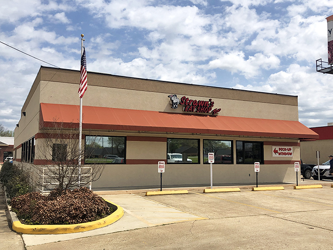 The exterior of Strawn's Eat Shop Too stands proudly against the Louisiana sky, a beacon of comfort food that's been calling hungry diners home for generations. 