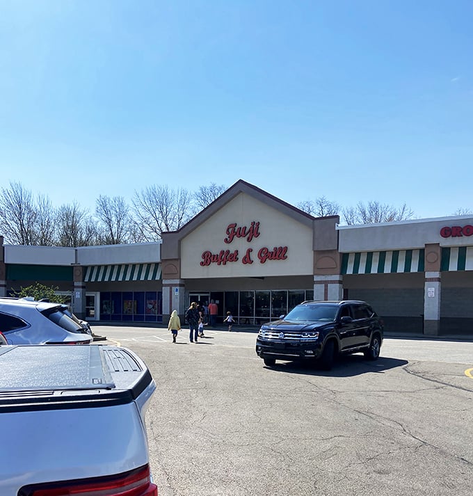 The bold red lettering of Fuji Buffet & Grill beckons like a siren song to hungry travelers on Mentor Avenue. Your stomach knows what that sign promises.