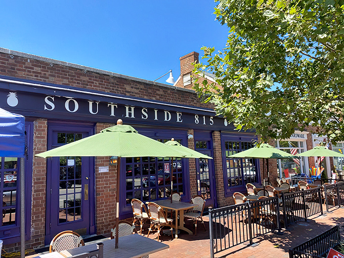 The inviting brick exterior of Southside 815 with its navy blue awning and charming patio seating beckons hungry travelers like a Southern lighthouse. 