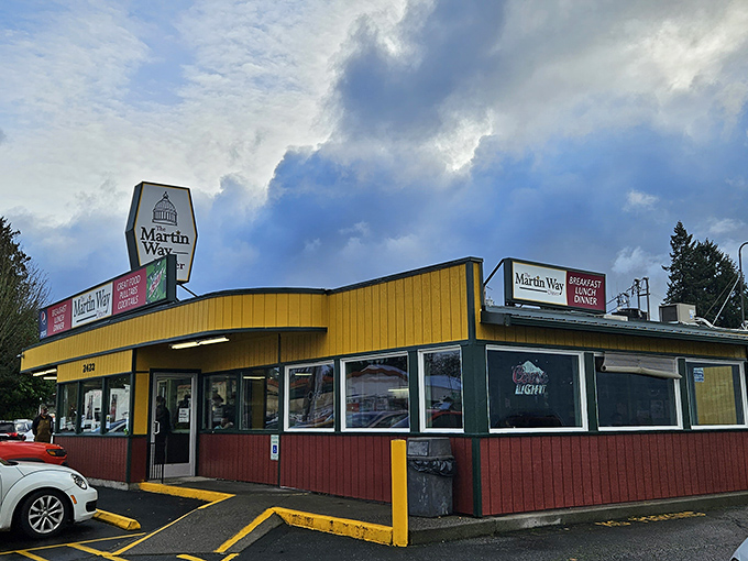 The sunshine-yellow exterior of Martin Way Diner stands out like a beacon of hope for hungry travelers. No fancy architecture needed when what's inside matters most.