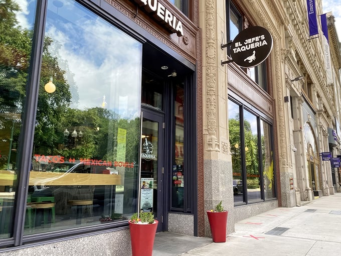 El Jefe's Taqueria nestles into Boston's historic architecture, its black circular sign beckoning hungry explorers like a taco lighthouse in a sea of brick and granite.