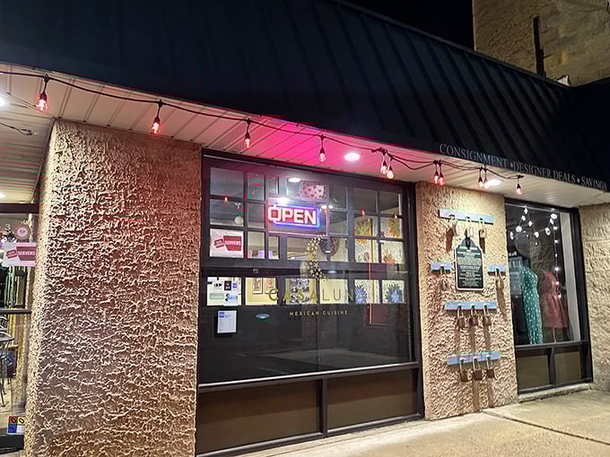 The welcoming patio at Casa Luna beckons like a culinary oasis in Somerville, where vibrant umbrellas and sunflowers promise Mexican delights inside.