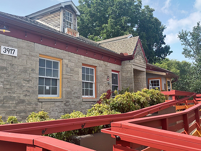 El Fuego's stone exterior with vibrant red trim stands out like a culinary lighthouse, beckoning hungry travelers with promises of authentic Mexican flavors.