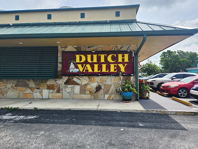 The iconic red Dutch Valley sign welcomes hungry travelers like a lighthouse guiding ships to comfort food harbor. That motorcycle knows what's up!