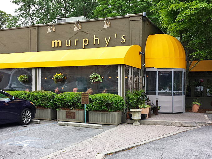 Murphy's signature yellow awning stands like a beacon of culinary delight in Atlanta's Virginia-Highland neighborhood, promising comfort and indulgence just beyond those doors.