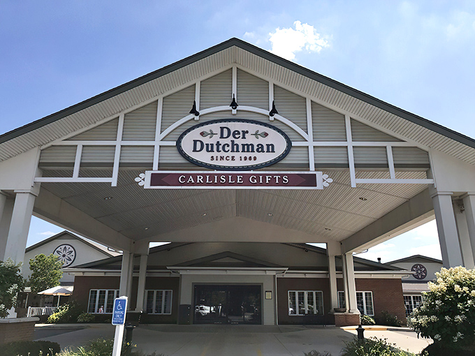 Der Dutchman's welcoming facade stands like a beacon of buttery hope along US-42, where both sedans and horse-drawn buggies find common parking ground.