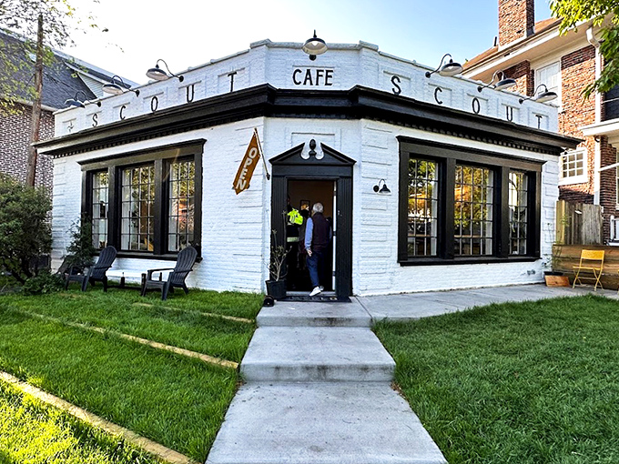 Scout Cafe's charming white brick exterior stands like a coffee oasis in Wilmington's Forty Acres neighborhood, promising caffeinated treasures within.