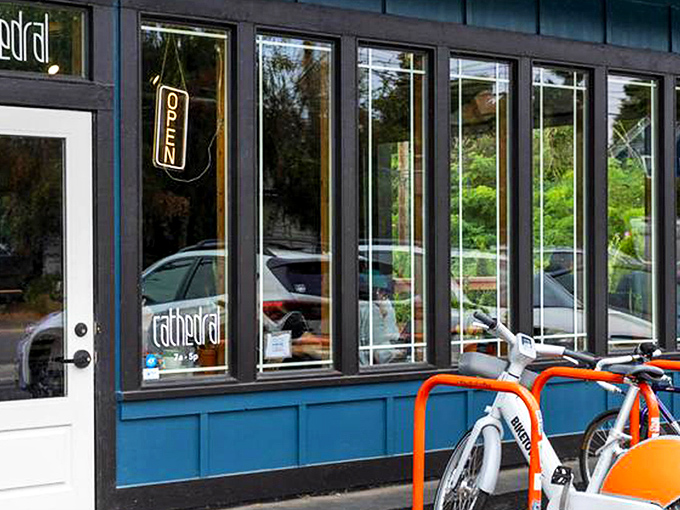 The blue-trimmed storefront with its glowing "OPEN" sign isn't just inviting&mdash;it's practically whispering sweet caffeinated promises to passersby.