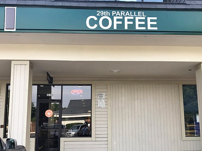 The unassuming storefront hides coffee greatness like a superhero's secret identity. Green signage and simple exterior belie the caffeinated magic happening inside.