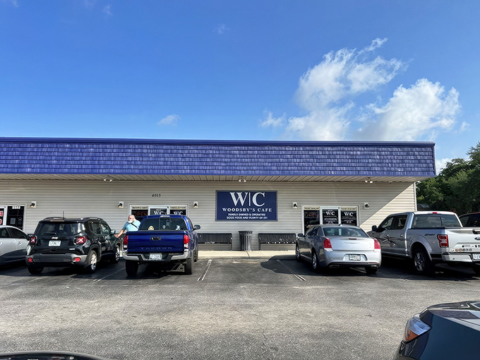 The unassuming exterior of Woodsby's Countryside Cafe stands as a beacon of hope for hungry travelers. No fancy frills, just the promise of honest food inside.