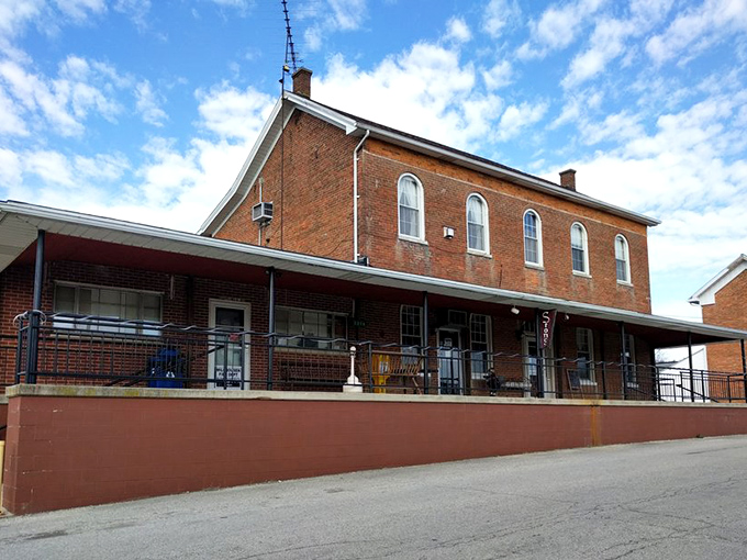 The historic brick building housing Stone's Family Restaurant stands proudly in Millhousen, its wraparound porch inviting hungry travelers to step back in time.