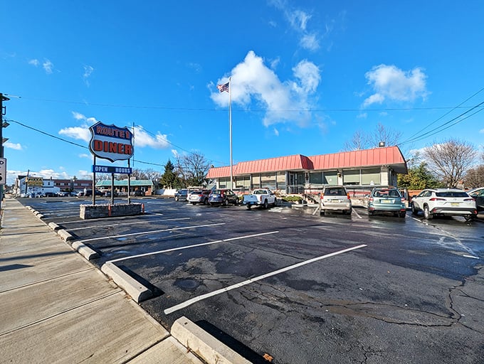 The iconic red roof of Route 1 Diner stands as a beacon to hungry travelers, promising comfort food and Jersey hospitality just off the highway.