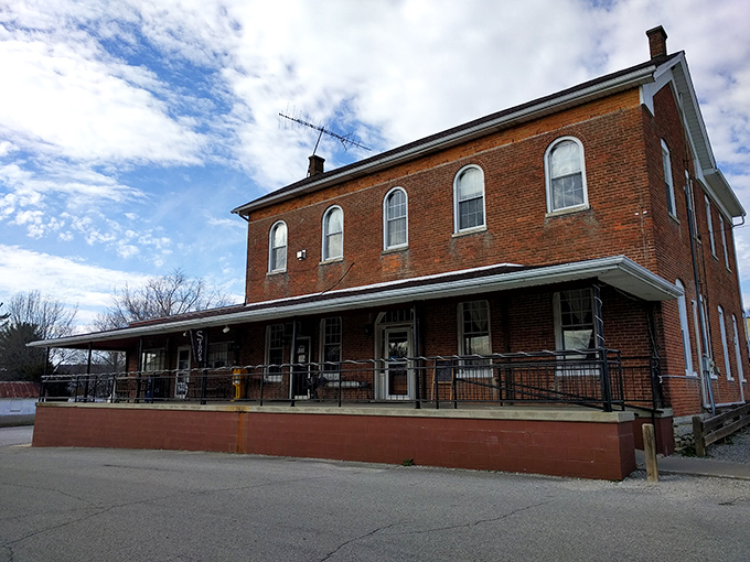 The historic brick building housing Stone's Family Restaurant stands proudly in Millhousen, its wraparound porch inviting hungry travelers to step back in time.