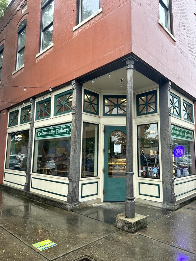 The iconic teal-trimmed entrance of Community Bakery beckons like an old friend, promising delicious treasures within its historic downtown walls.