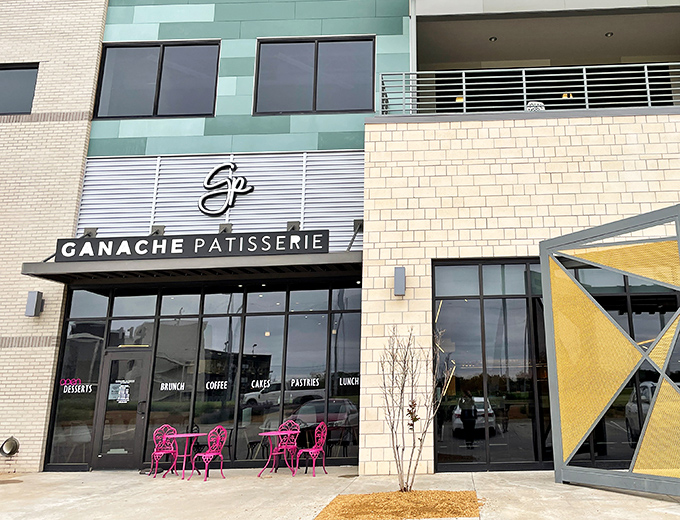 The sleek exterior of Ganache Patisserie promises Parisian delights in Oklahoma City. That blue umbrella beckons like a culinary oasis in the urban landscape.