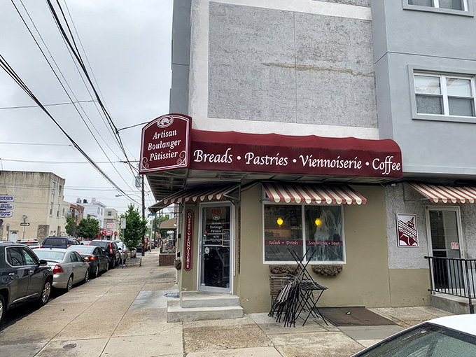 The charming exterior of Artisan Boulanger Patissier beckons from its South Philly corner, promising French delights behind that unassuming burgundy awning. 