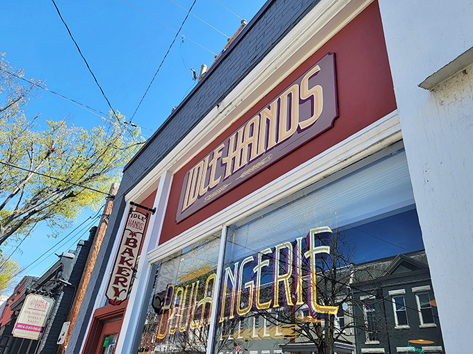 The iconic red storefront of Idle Hands beckons carb enthusiasts like a lighthouse guiding hungry ships to buttery shores.