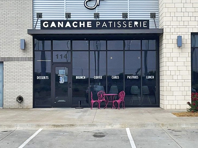 The sleek exterior of Ganache Patisserie promises Parisian delights in Oklahoma City. That blue umbrella beckons like a culinary oasis in the urban landscape.