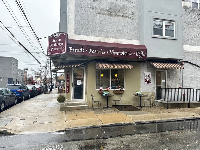 The charming exterior of Artisan Boulanger Patissier beckons from its South Philly corner, promising French delights behind that unassuming burgundy awning. 