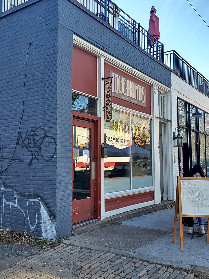 The iconic red storefront of Idle Hands beckons carb enthusiasts like a lighthouse guiding hungry ships to buttery shores.