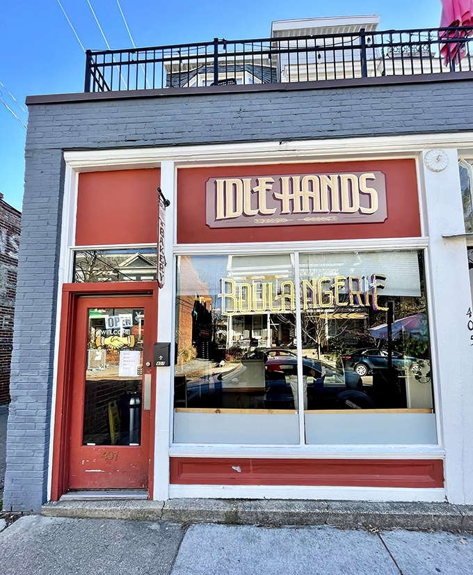 The iconic red storefront of Idle Hands beckons carb enthusiasts like a lighthouse guiding hungry ships to buttery shores.