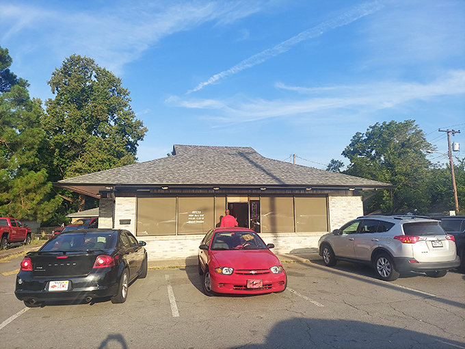 The unassuming storefront where donut dreams come true. Blue skies above, sweet treasures within&mdash;North Little Rock's hidden gem awaits.