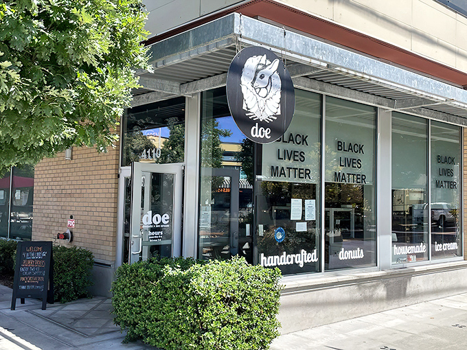 The storefront beckons with its clean lines and promise of handcrafted delights. Black Lives Matter signs show this is a place with both conscience and confections. 